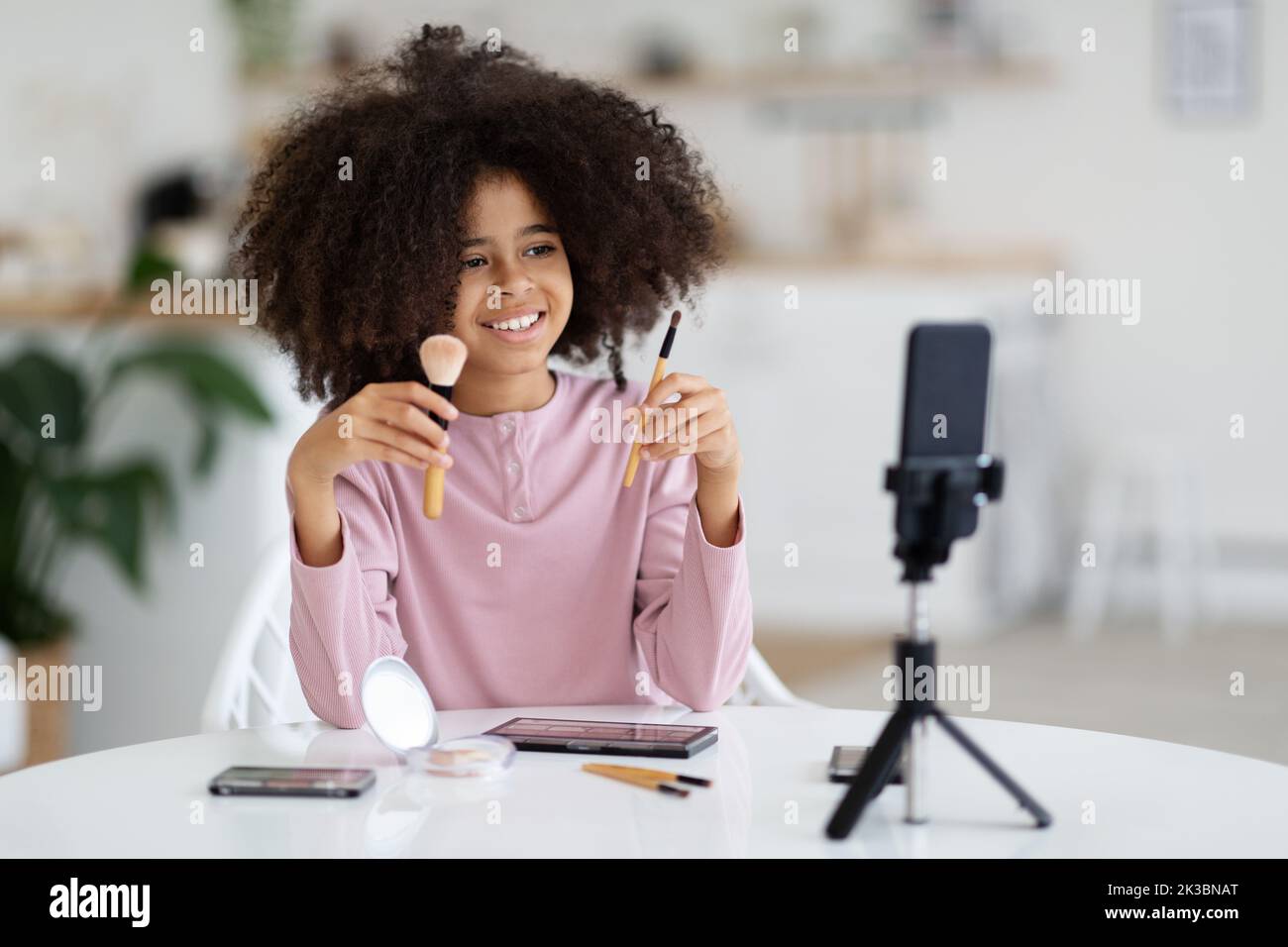Adorable african american child girl streaming from home Stock Photo ...