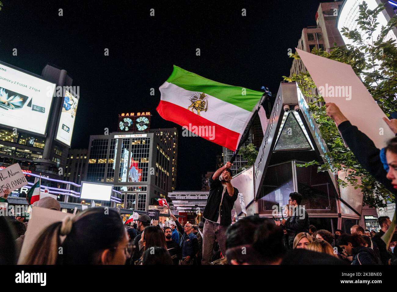 Toronto, Canada. 23rd Sep, 2022. A protester waves an Iranian flag ...