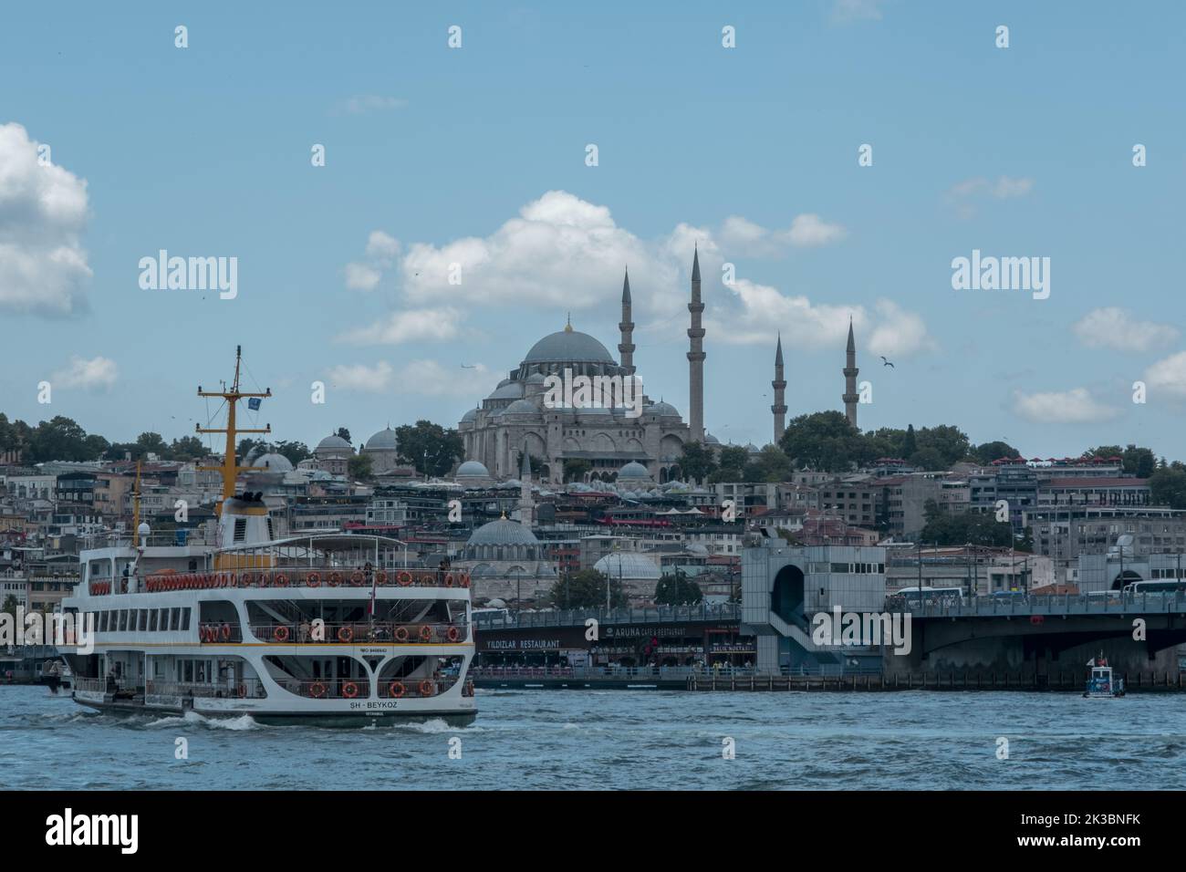 Wide angle Istanbul view with Suleymaniye Mosque, ferryboat and blue ...