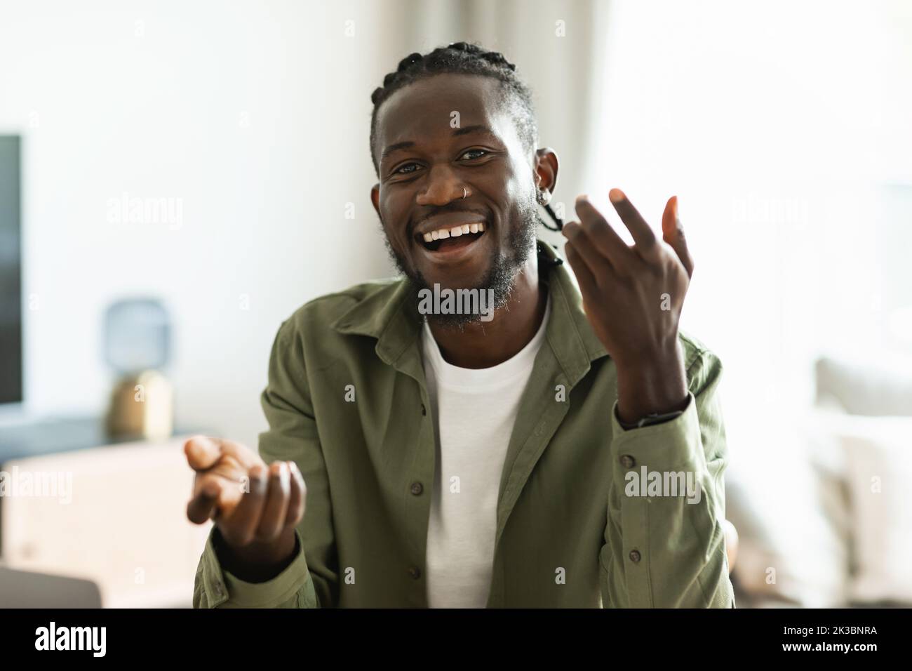 Video call concept. Happy african american man talking to camera ...