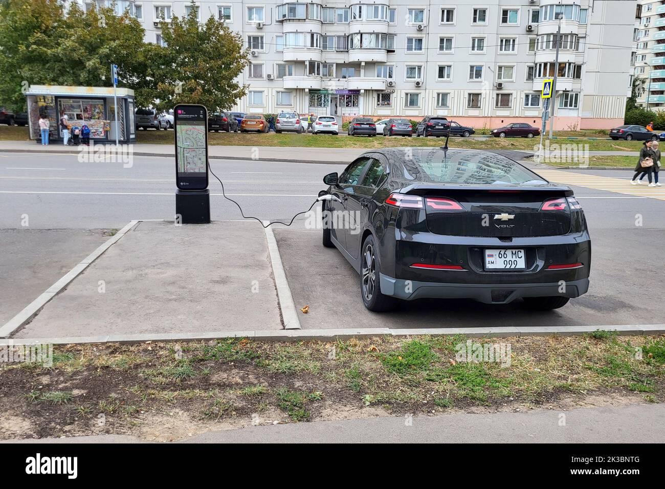 Charging a Chevrolet Volt electric car on a city street - Moscow ...