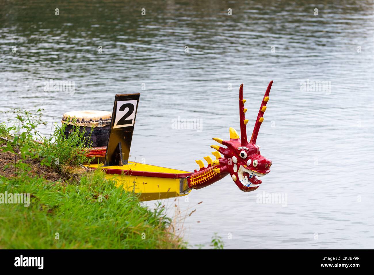 colorful dragon head on a dragon boat. A dragon boat is a human powered ...