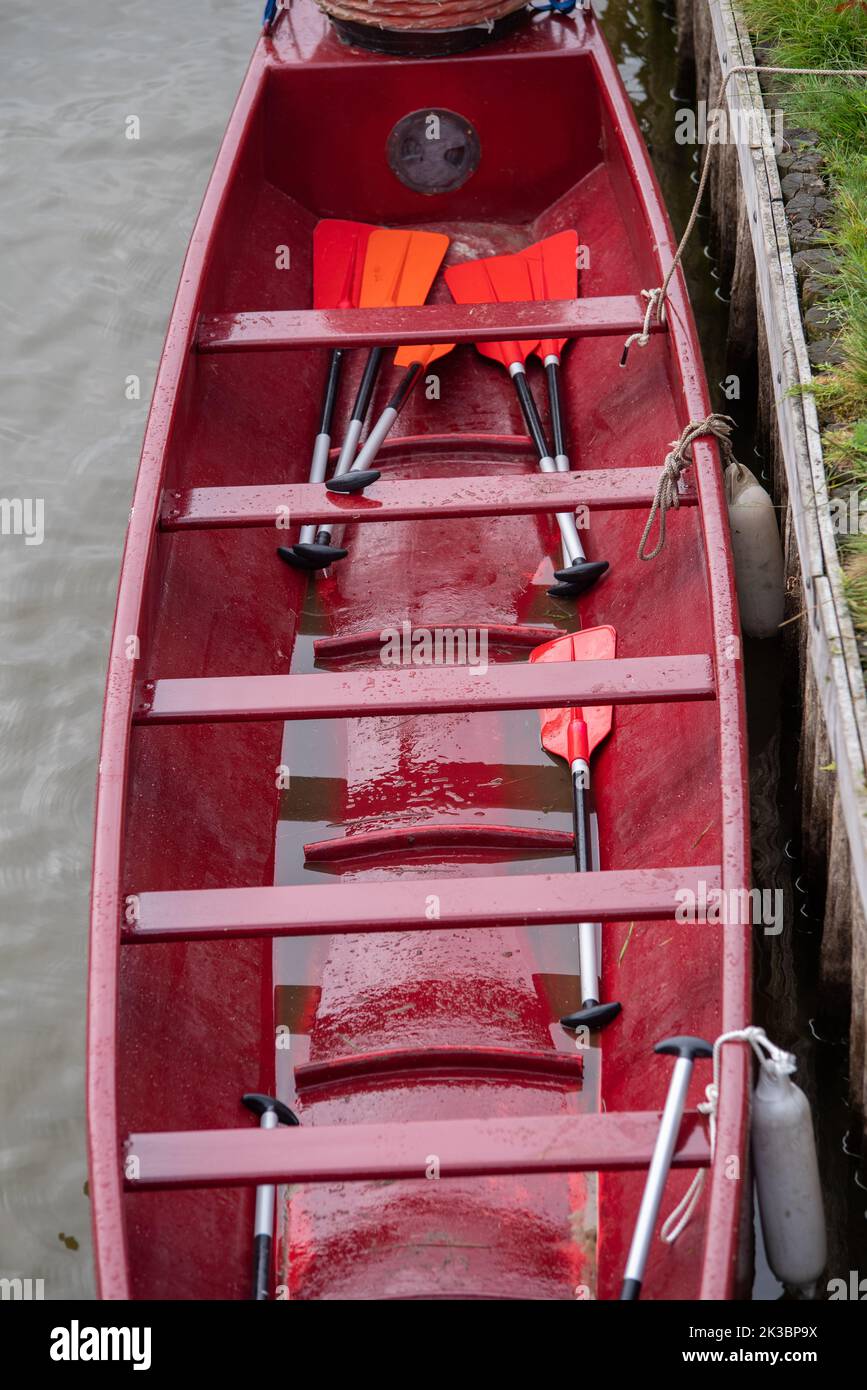 iside a dragon boat. A dragon boat is a human powered watercraft ...