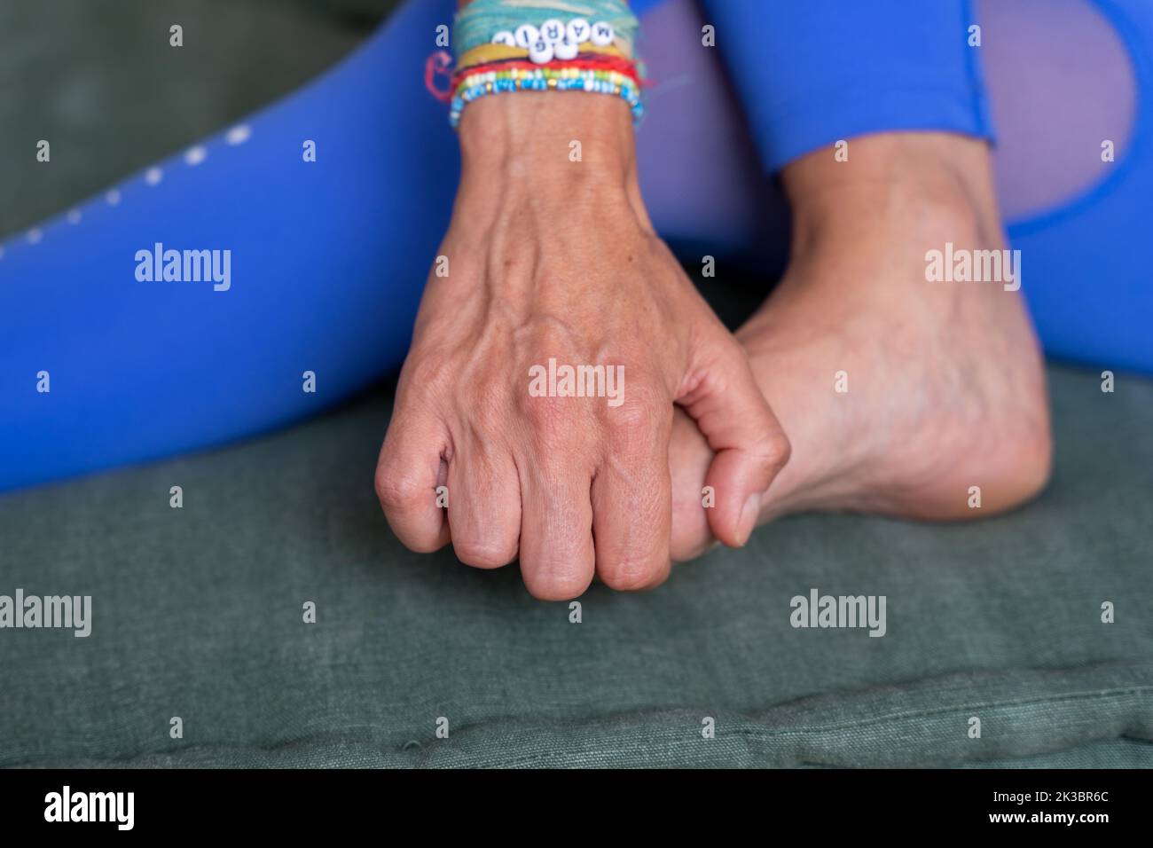 Yoga pose hand holding foot hi-res stock photography and images - Alamy