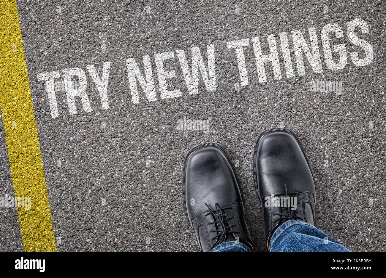 Text on the road - Try new things Stock Photo - Alamy