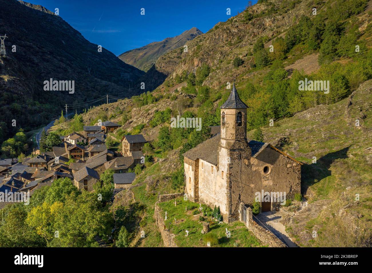 Aerial view of the town of Lladorre and the surrounding green fields in ...