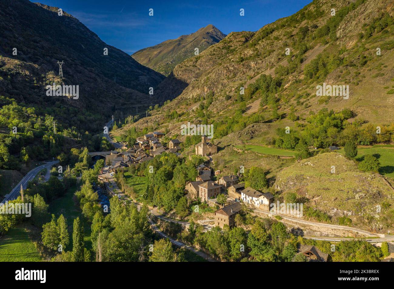 Aerial view of the town of Lladorre and the surrounding green fields in ...