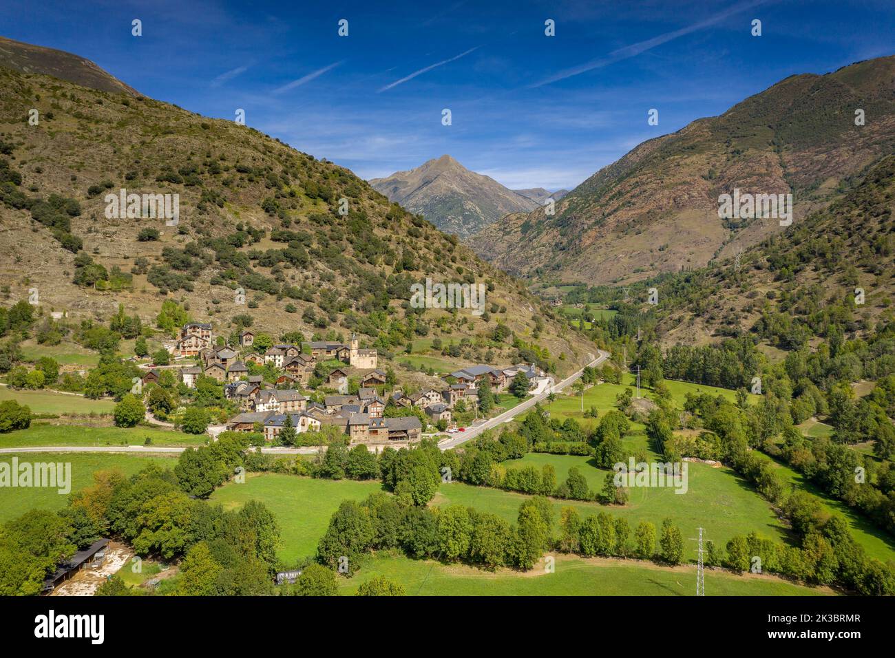 Aerial view of the town of Lladrós and the surrounding green fields, in ...