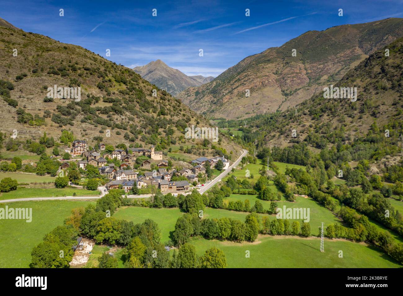 Aerial view of the town of Lladrós and the surrounding green fields, in ...
