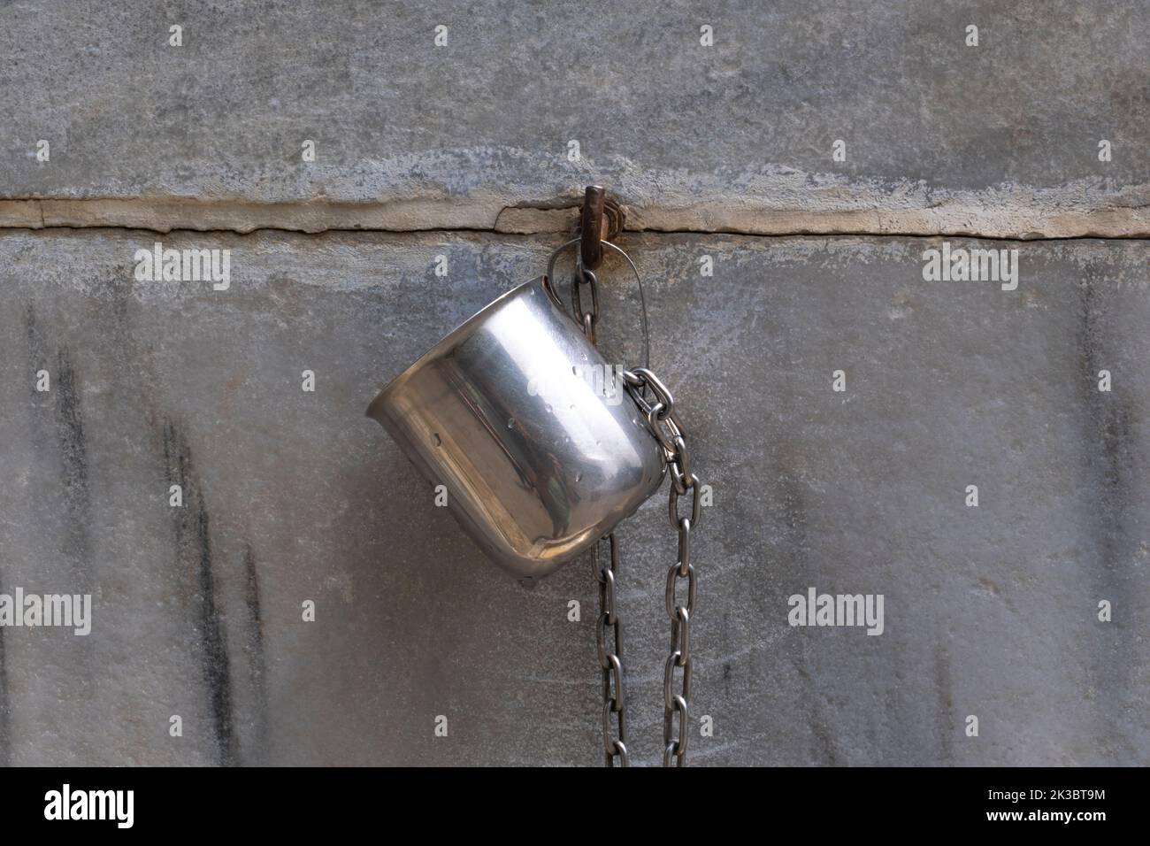Old steel cup with chain, old fashion protected metal glass ...