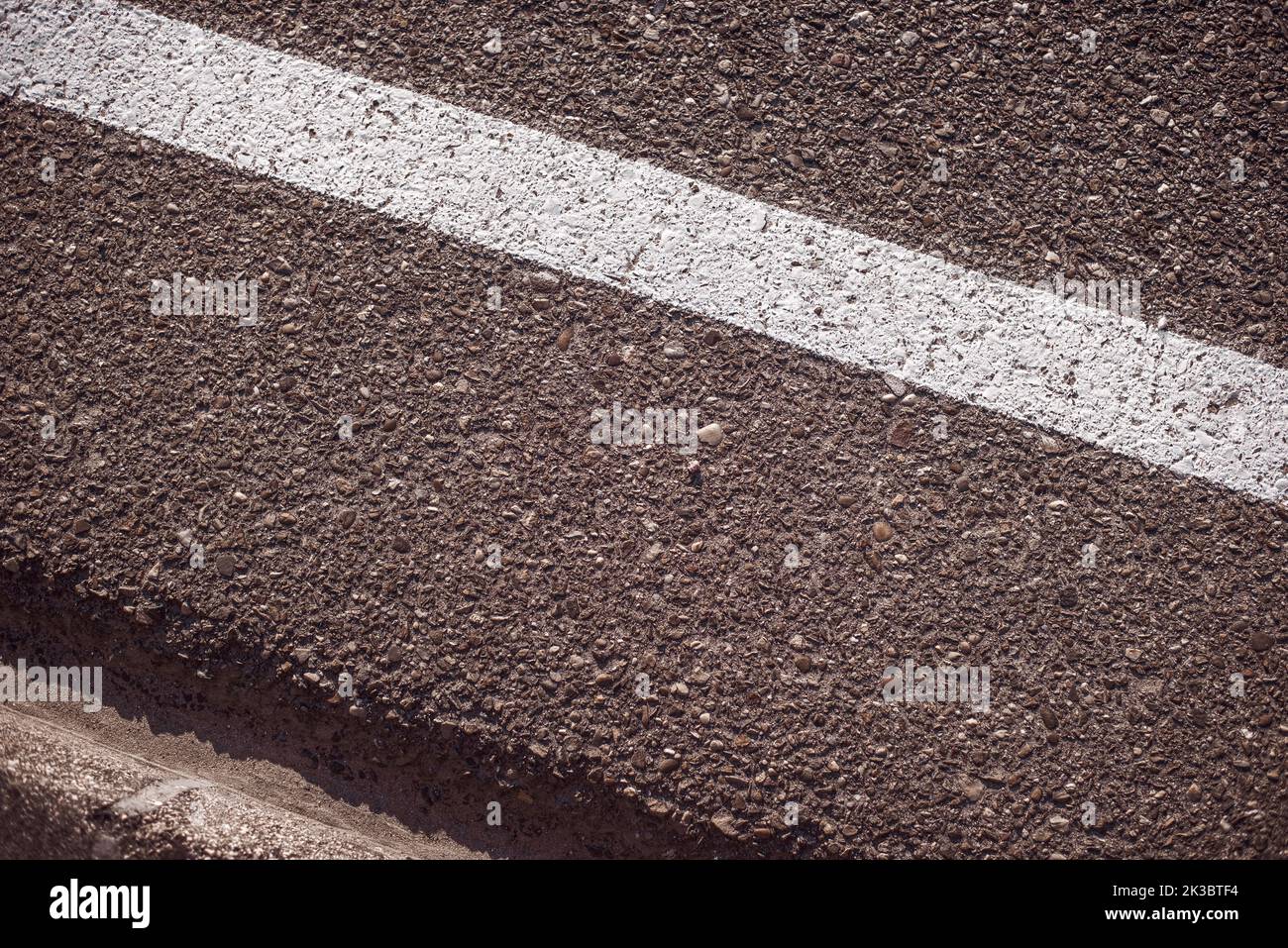 Roadside closeup with a white painted line Stock Photo - Alamy