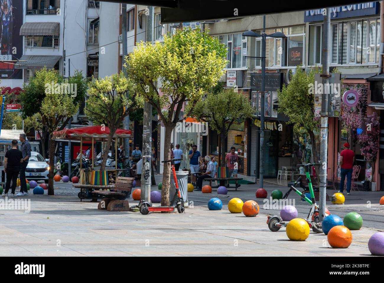 Colorful street view with cars, people walking in Bahariye street ...