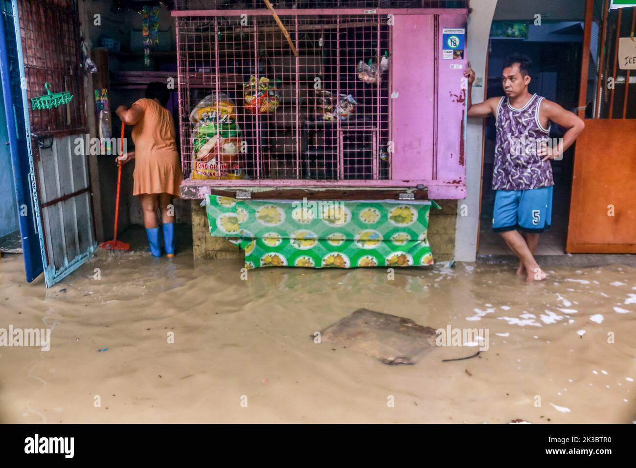 Super typhoon victims clean their houses after the raging wind and rain ...