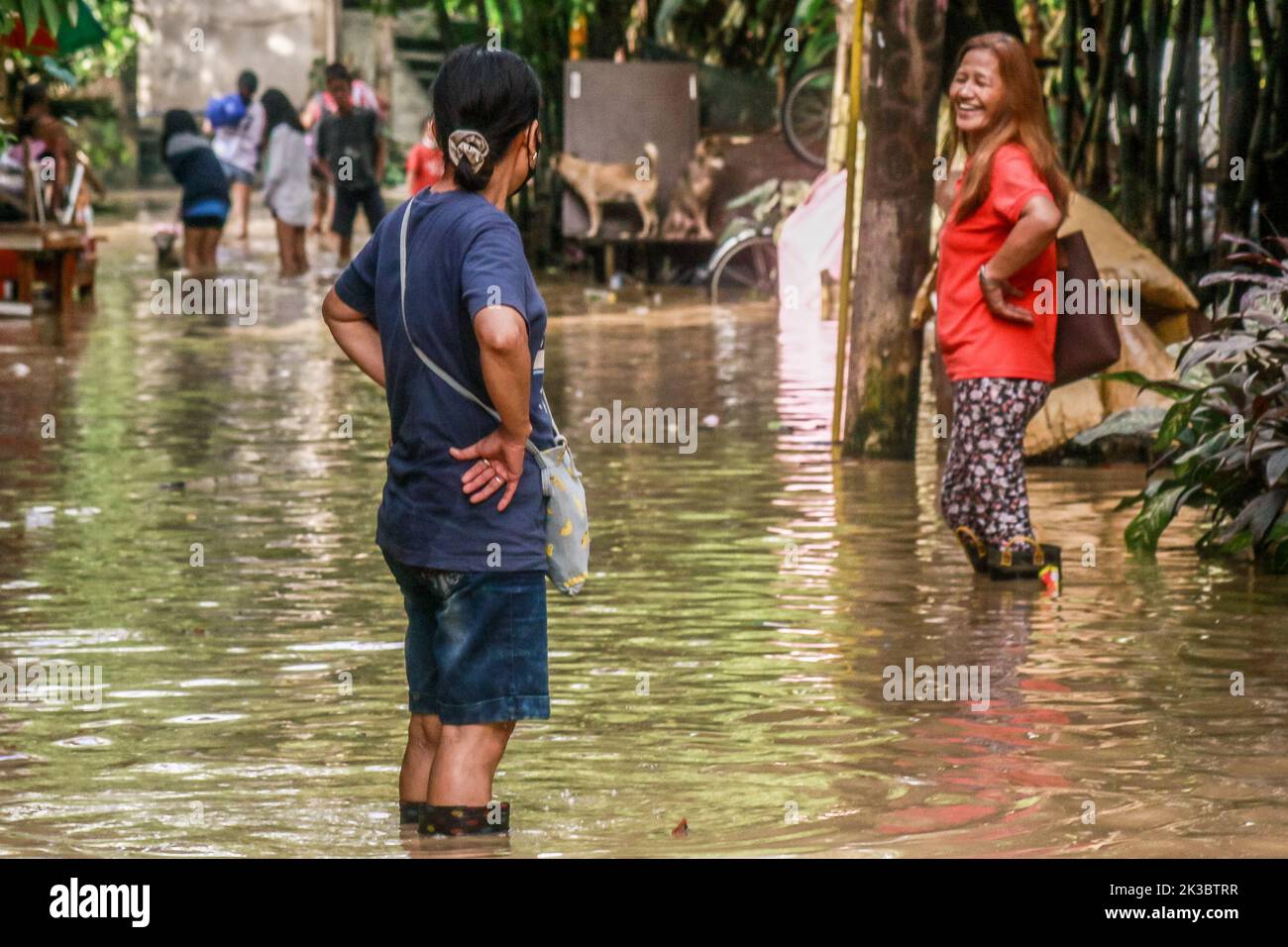 Marikina, Philippines. 26th Sep, 2022. Super typhoon victims walk on a ...