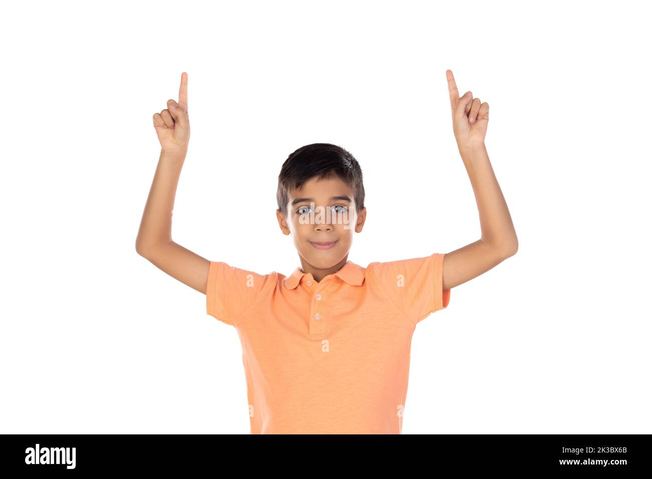 Smiling cute little boy standing and pointing away isolated on a white ...