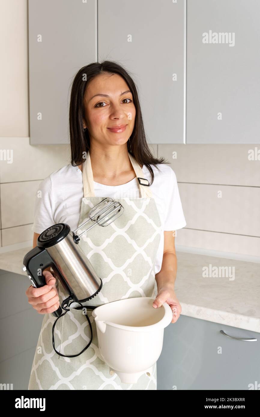 Whipping the cream for ganache. Baking process stages Stock Photo - Alamy