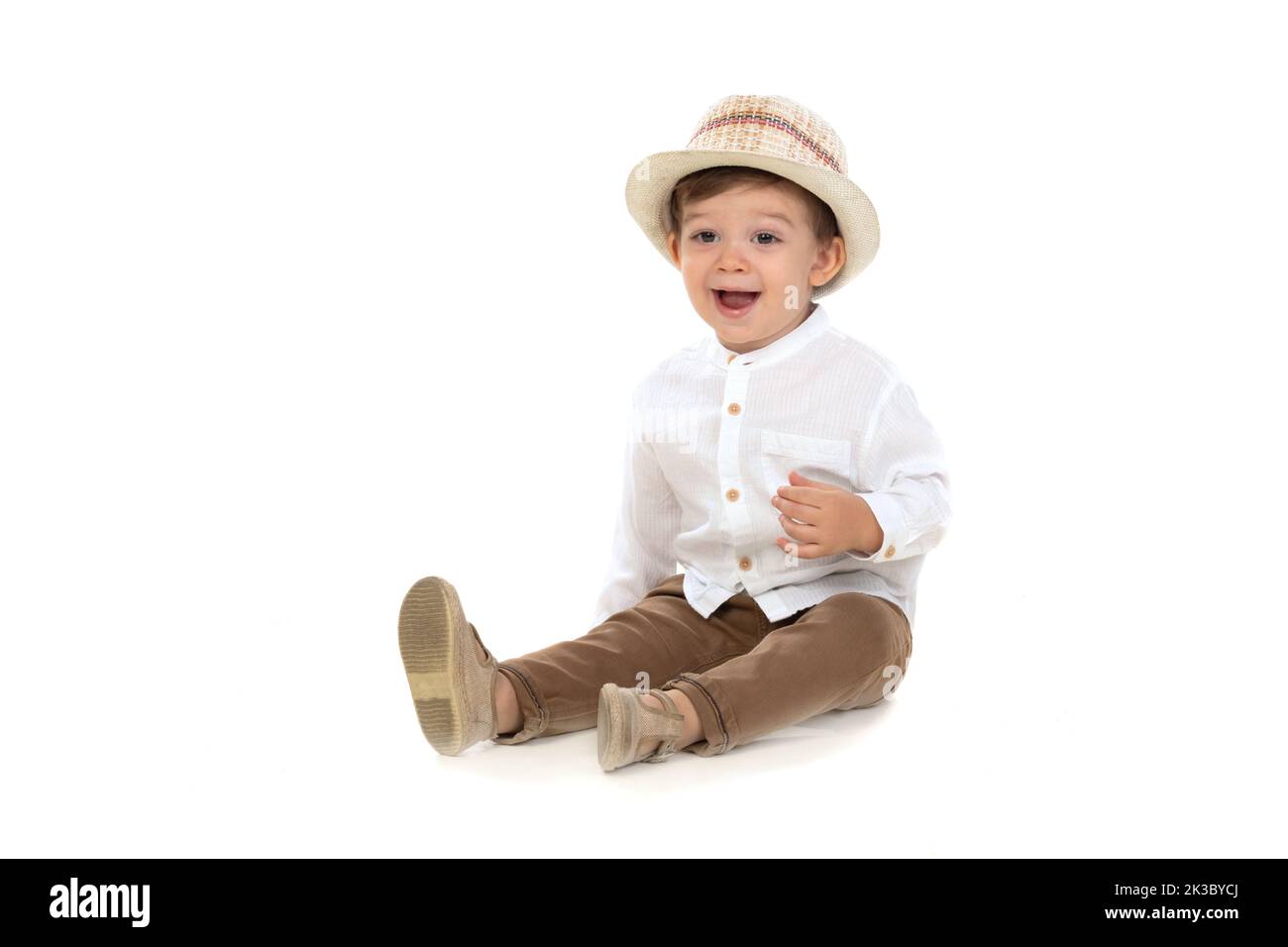 Cool stylish little boy in a hat. Isolated on white background Stock ...