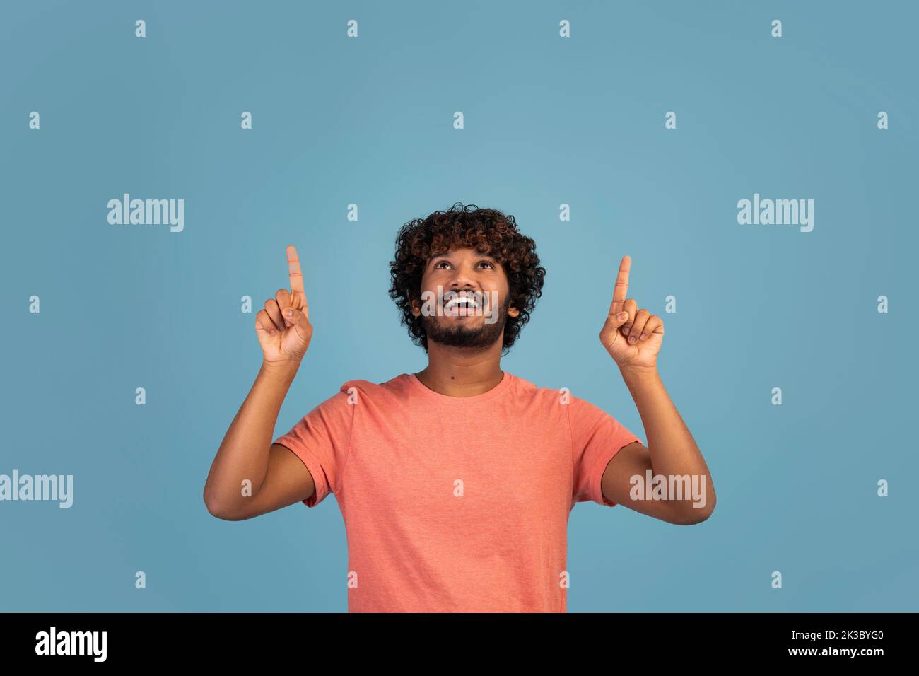 Positive hindu guy pointing hi-res stock photography and images - Alamy