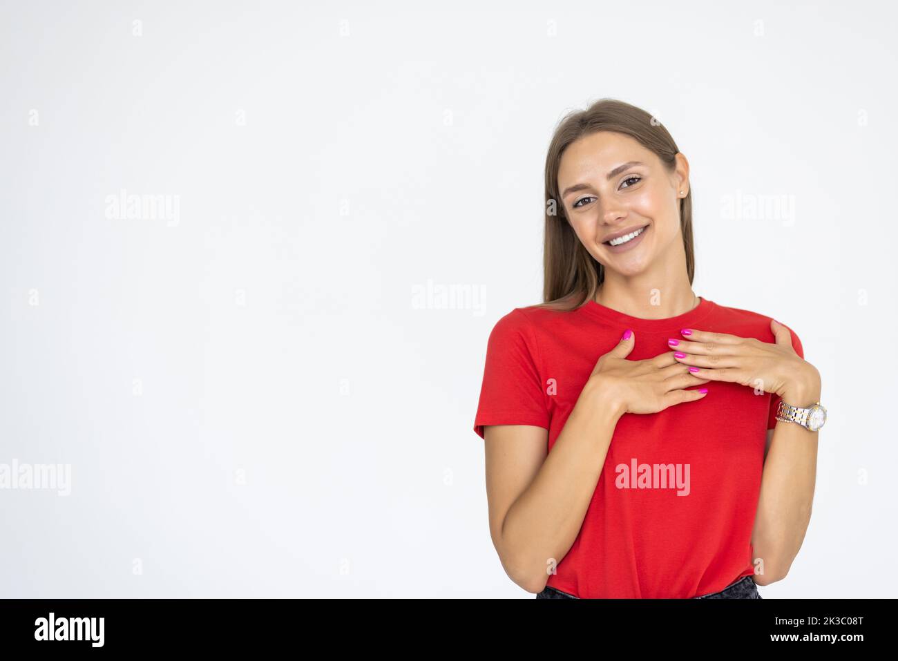Happy candid woman laughing and smiling carefree, touching chest while ...