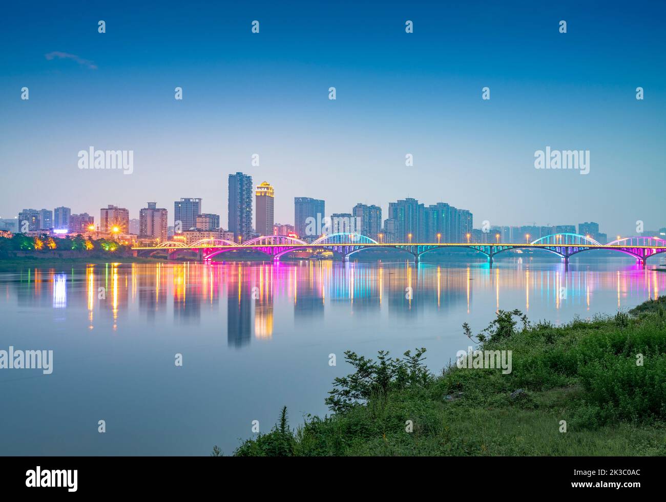 The Min River Bridge in Leshan, China, and the city at night Stock ...
