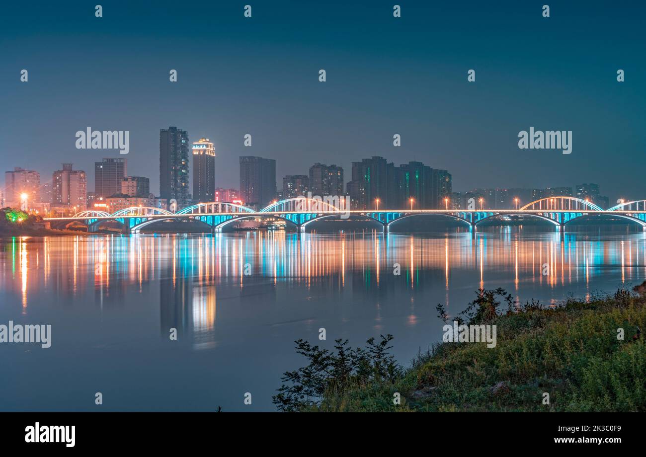 The Min River Bridge in Leshan, China, and the city at night Stock ...