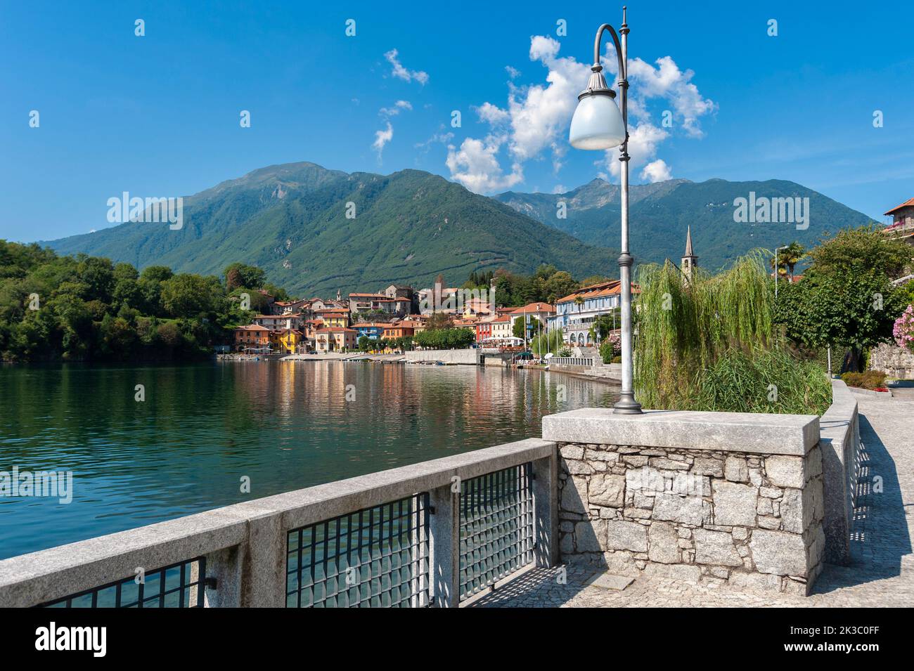 Promenade on the Lago di Mergozzo with a view of the village of ...