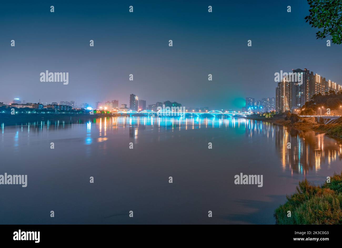 The Min River Bridge in Leshan, China, and the city at night Stock ...