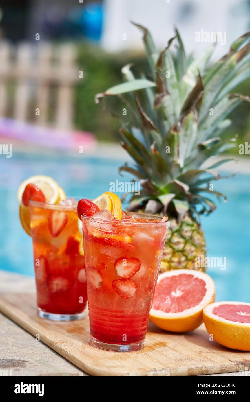 fruit cocktails by the pool Stock Photo - Alamy