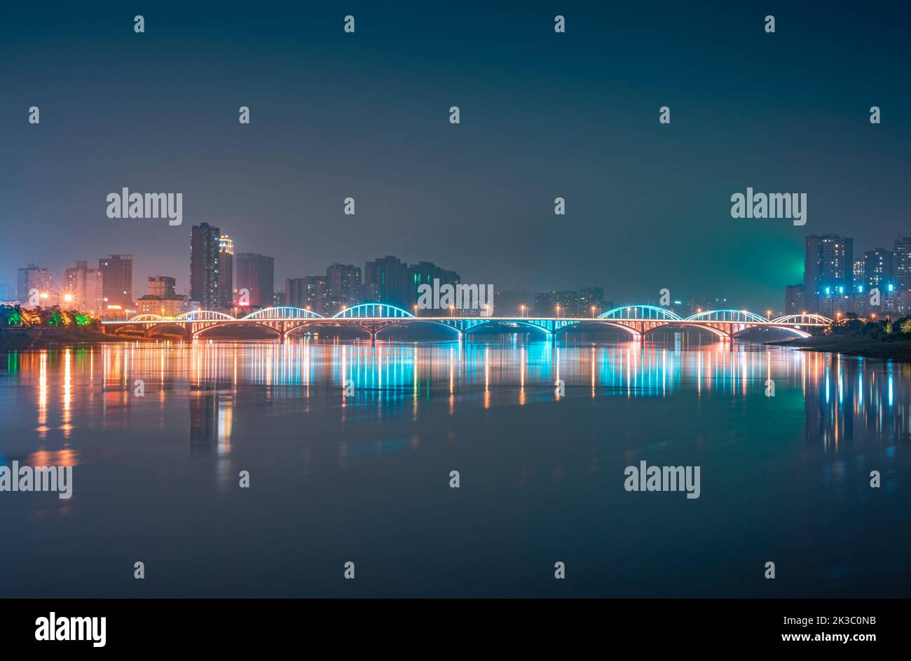 The Min River Bridge in Leshan, China, and the city at night Stock ...