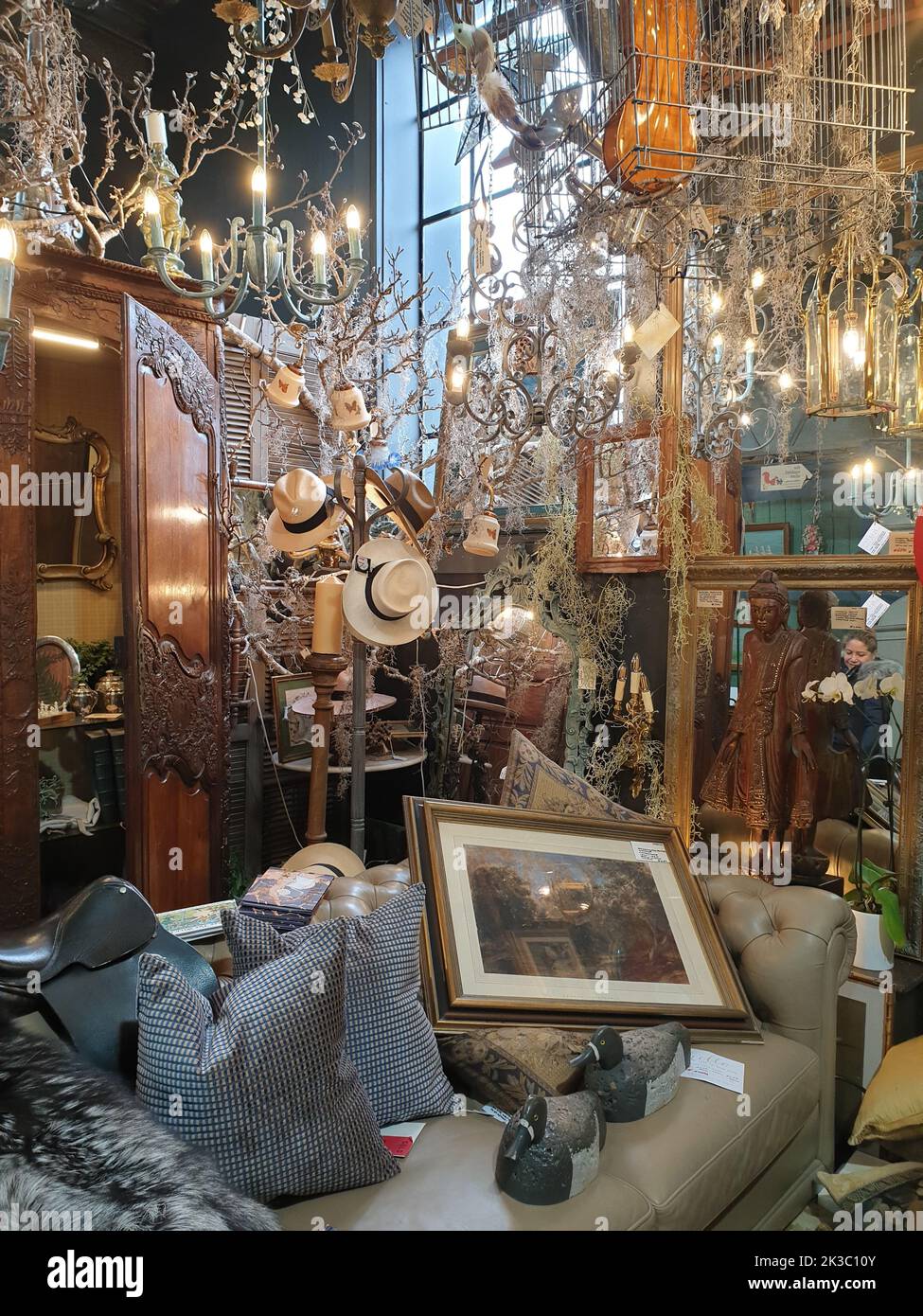 A vertical shot of miscellaneous stuff in an antique second-hand ...