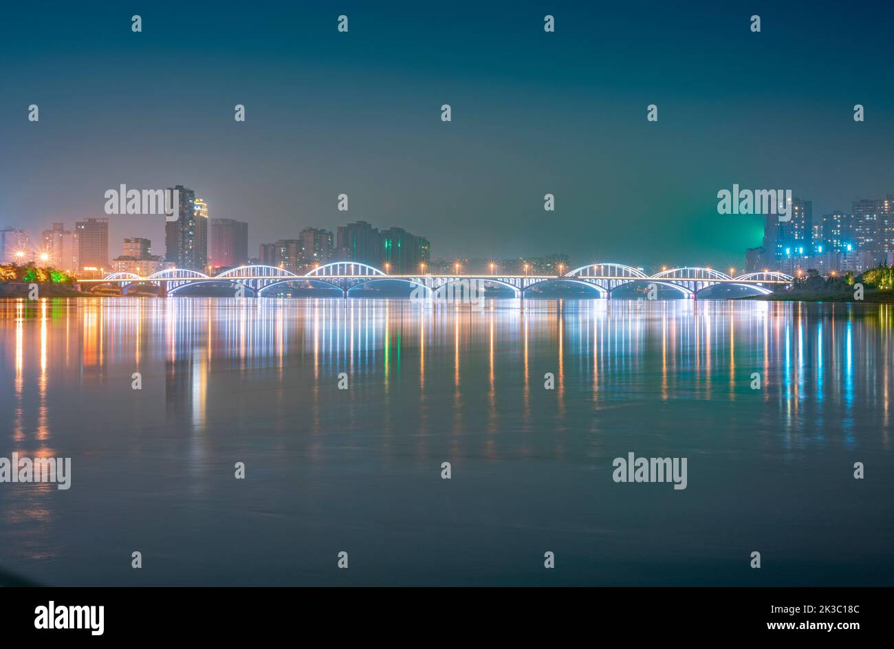 The Min River Bridge in Leshan, China, and the city at night Stock ...