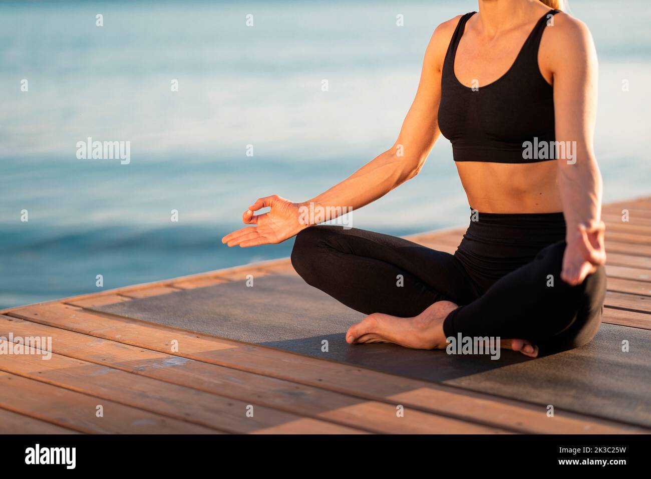 Fit young female meditating hi-res stock photography and images - Alamy
