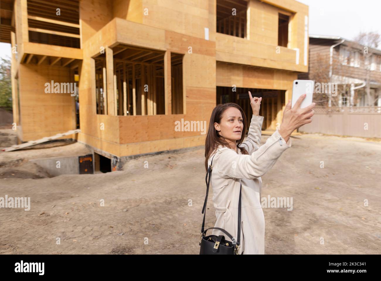 Standing watching construction site architecture building exterior hi ...