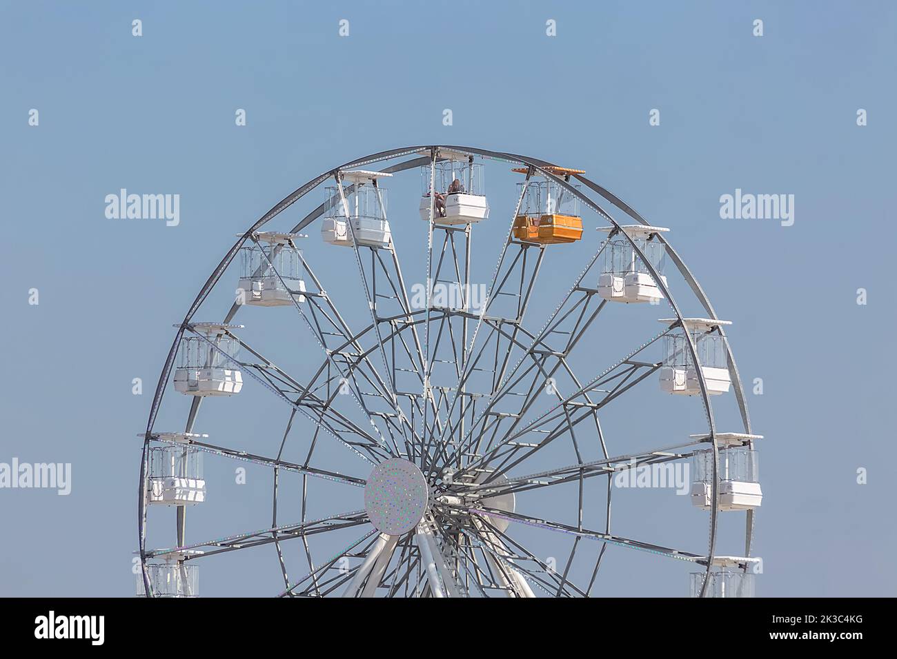 View of a classic giant ferris wheel with chairs, metallic structure ...