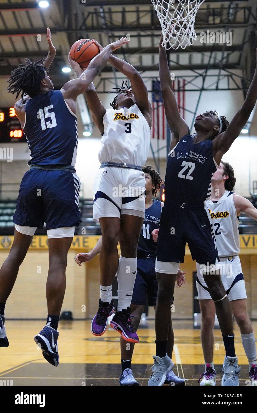 A vertical of a black athletic basketball player attempting to shoot ...