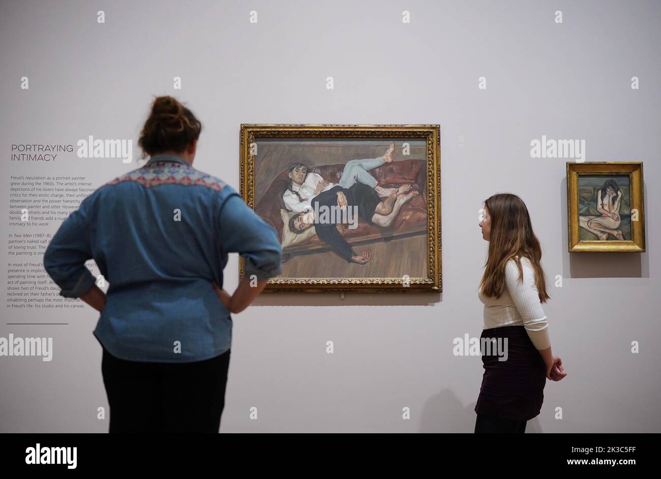 Gallery staff members pose next to paintings by Lucian Freud (L-R ...