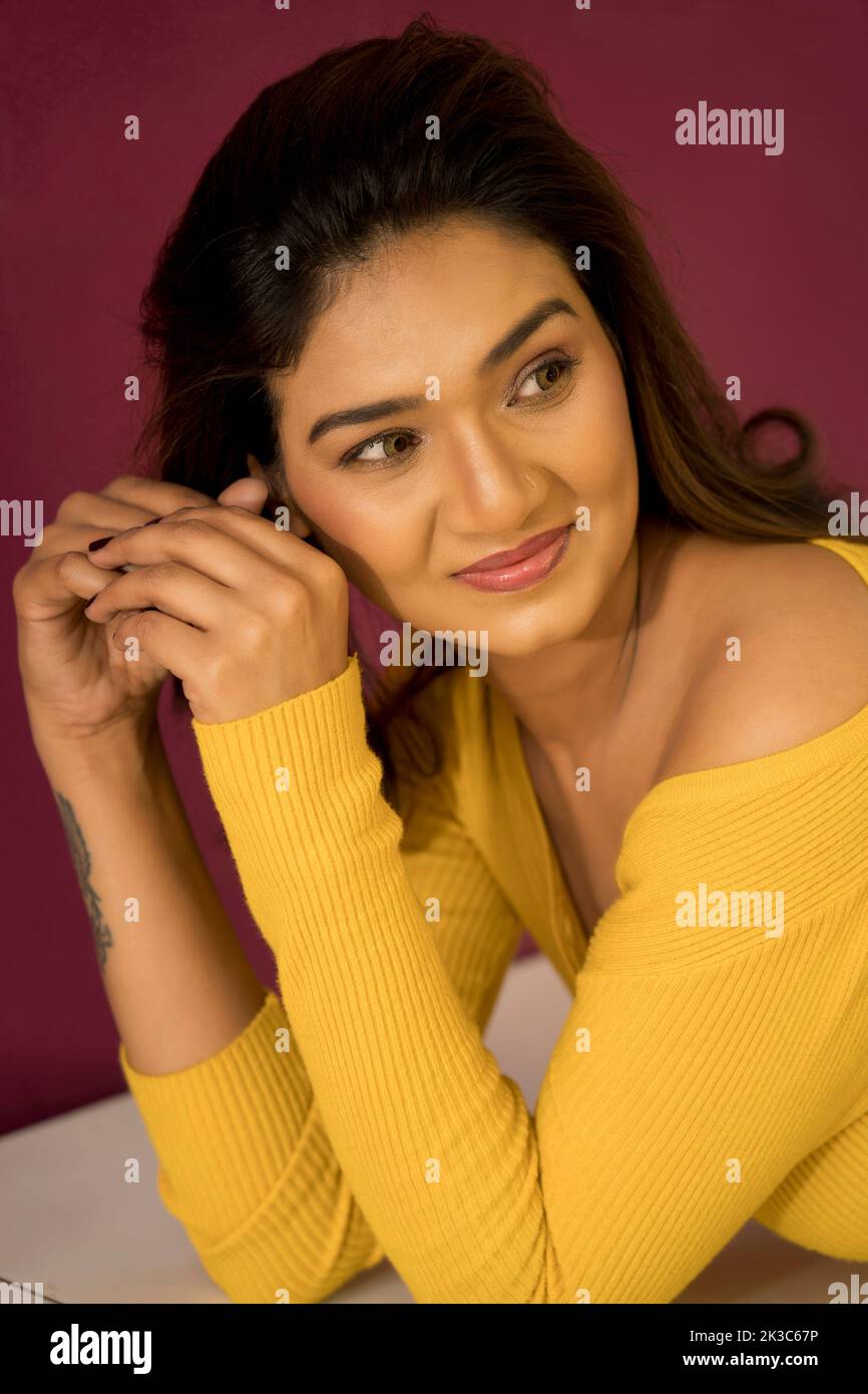 Young model girl in yellow top closeup of face, looking sideways Stock ...