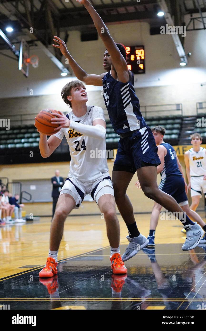 A vertical of athletic basketball players competing for the ball ...