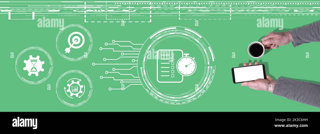Top view of hands holding a mobile phone and a cup of coffee with ...