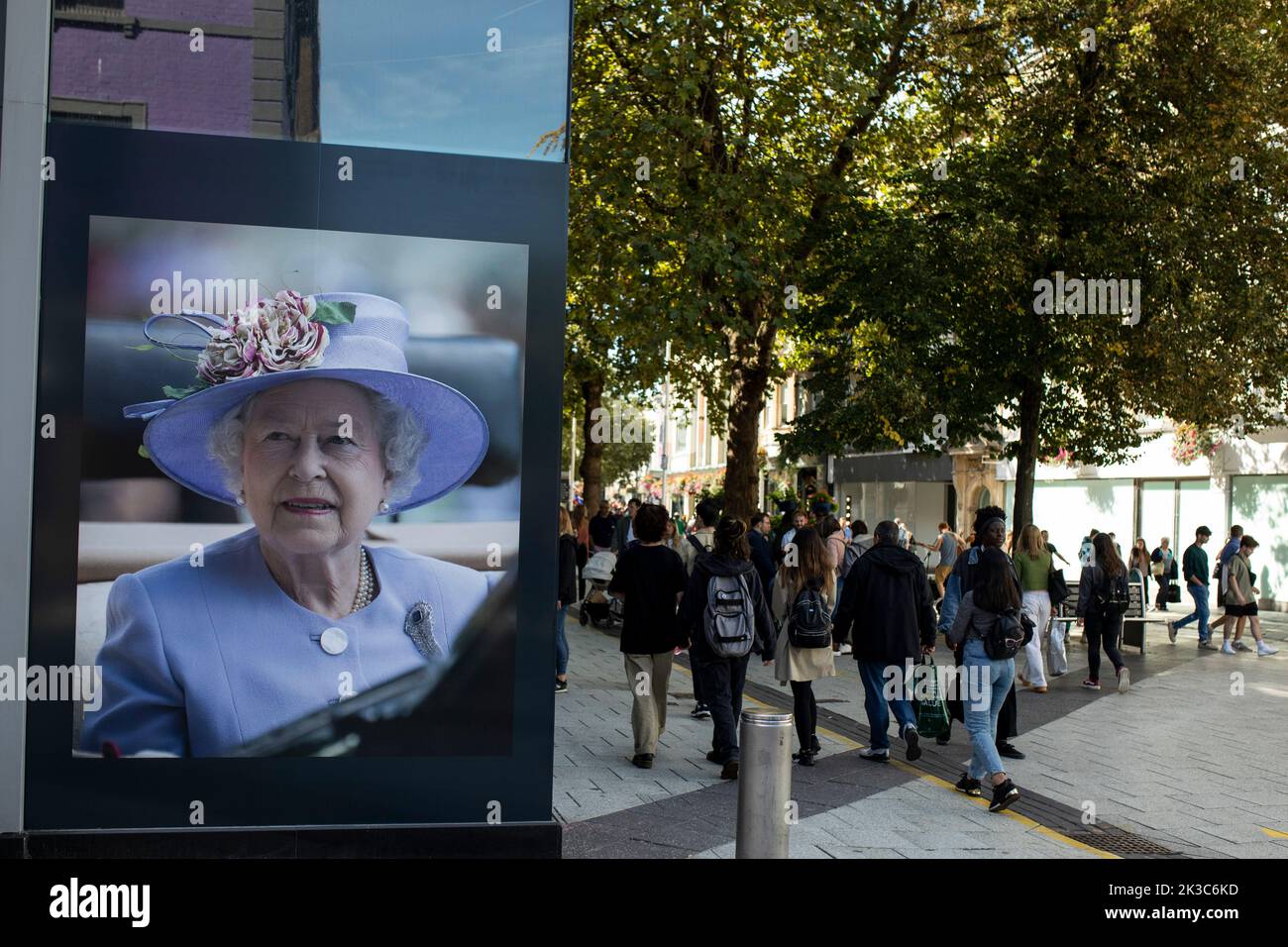 People in Cardiff City centre pass a tribute to Queen Elizabeth II in ...