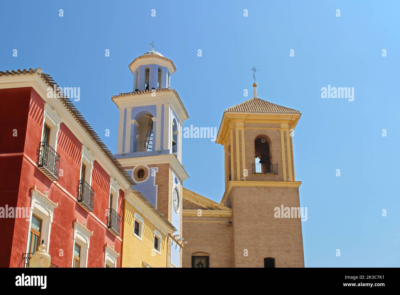 An exterior view of the church of San Miguel Arcangel, in Mula, Spain, in blue sky background ...