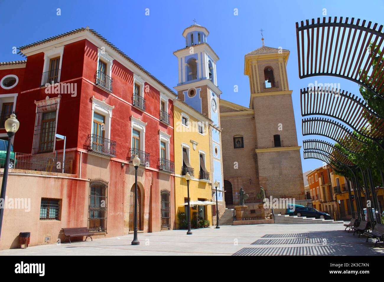 An exterior view of the church of San Miguel Arcangel in Mula, Spain, in blue sky background ...