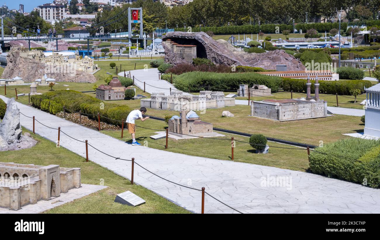 Little kid takes photo in Miniaturk, sightseeing destination in ...