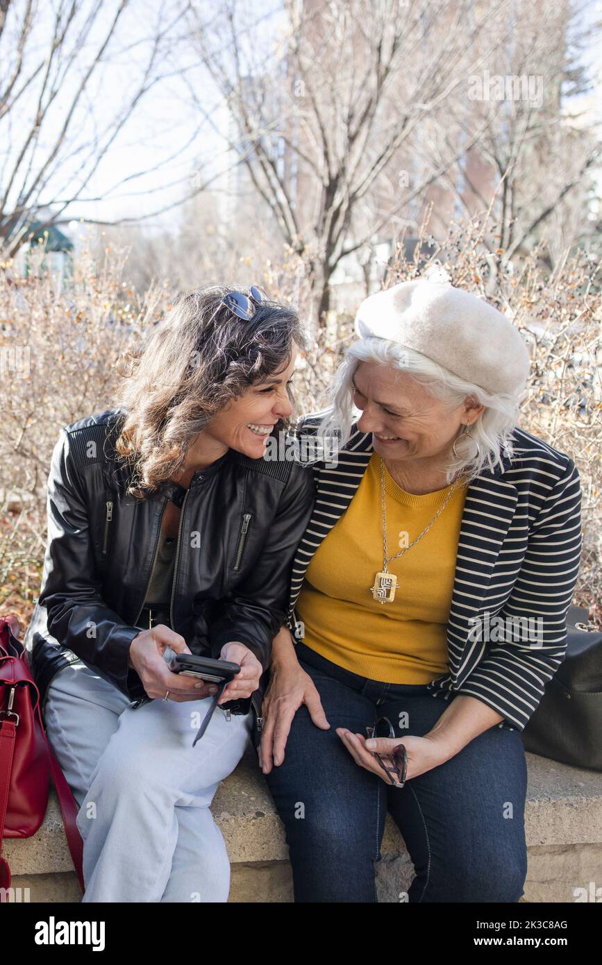 Two mature women friends smiling hi-res stock photography and images ...
