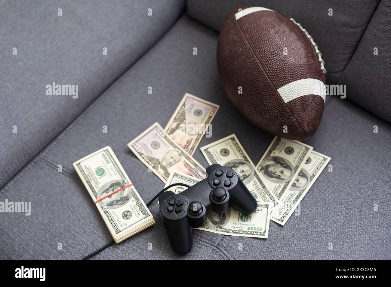 Football ball and money. video game at home Stock Photo - Alamy