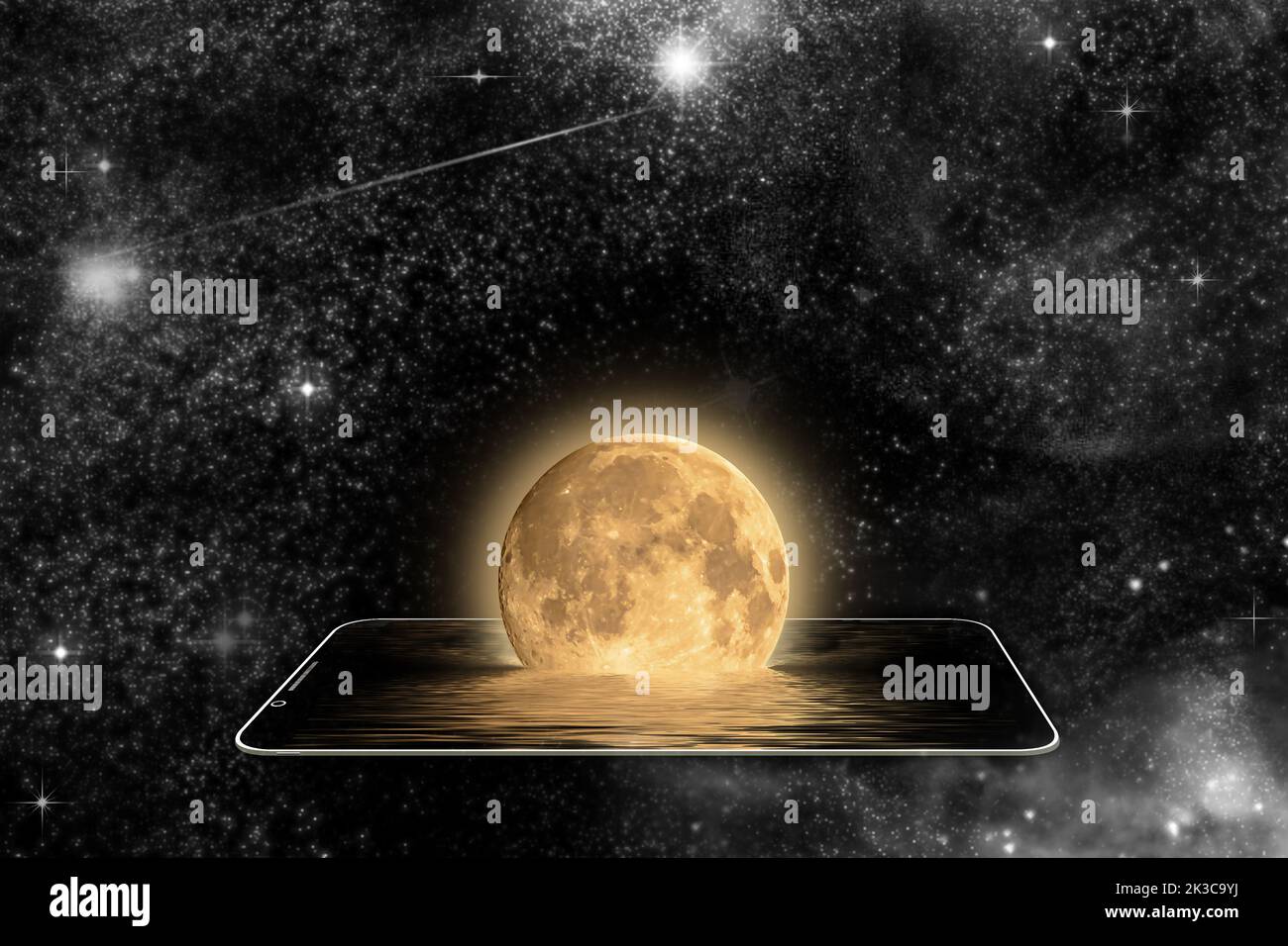 The yellow full moon in water on the tablet screen isolated on starry ...