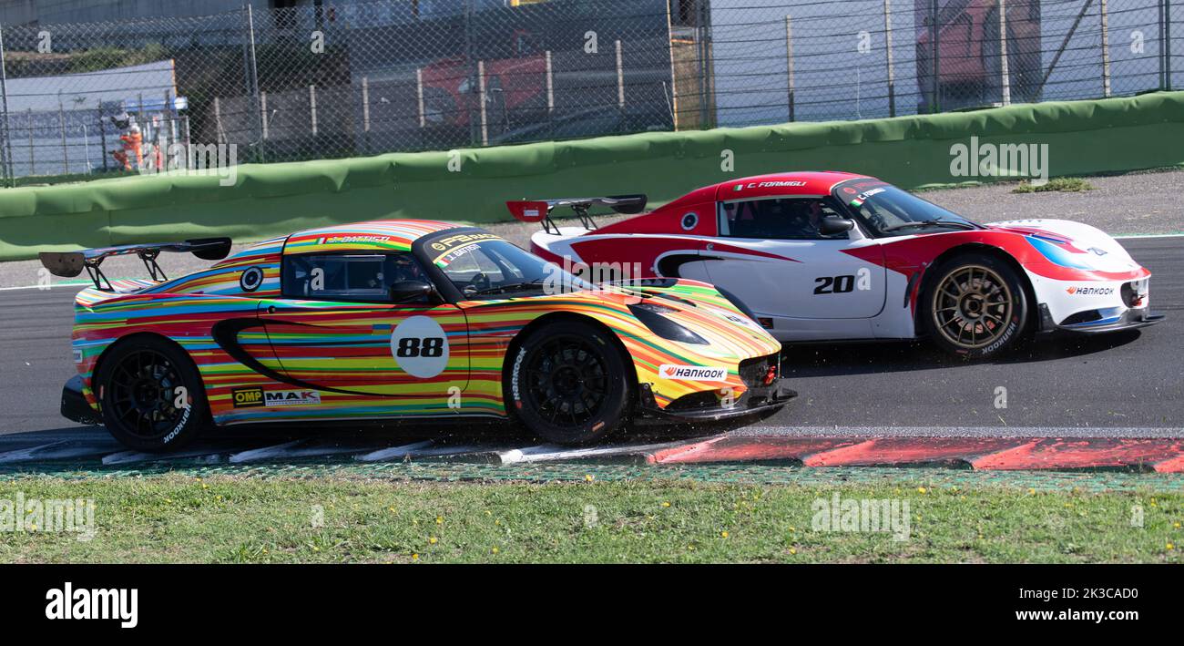 Lotus Exige race cars challenge overtaking on racetrack. Vallelunga 10 ...