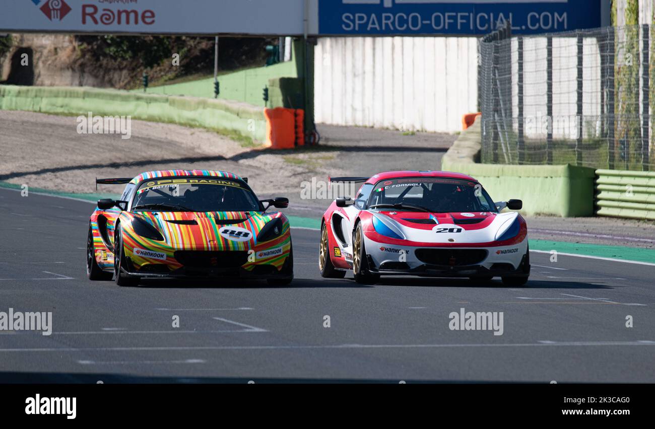 Lotus Exige race cars challenge overtaking on racetrack. Vallelunga 10 ...
