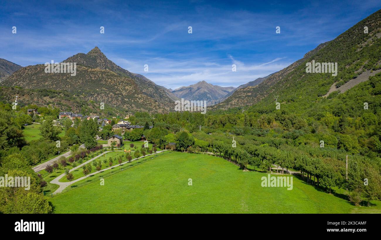 Aerial view of some green fields of the Cardós valley near the village ...