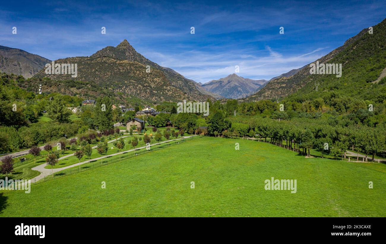 Aerial view of some green fields of the Cardós valley near the village ...